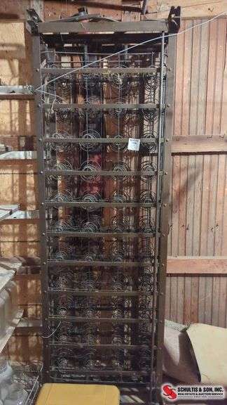 Vintage box springs with gun case behind - SCHULTIS & SON, INC.