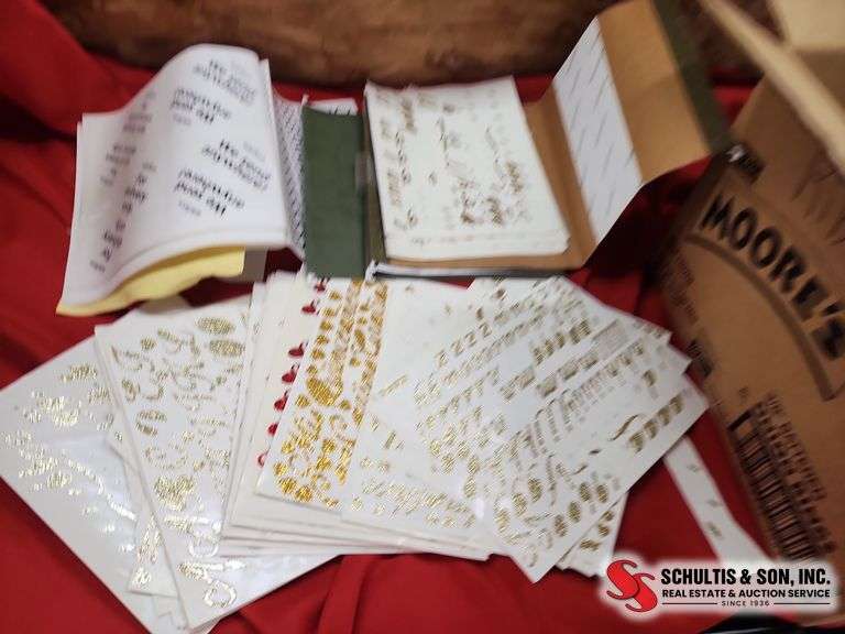 box full of stickers more in box - SCHULTIS & SON, INC.