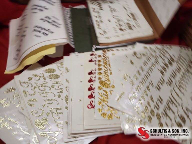 box full of stickers more in box - SCHULTIS & SON, INC.
