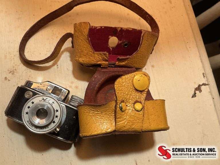 Tiny hit camera, ashtrays, and coasters - SCHULTIS & SON, INC.