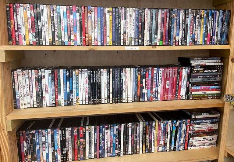3 Shelves of popular DVD’s - Sherwood Auctions