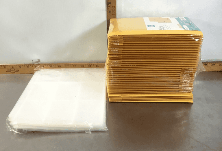 Manila Bubble Mailers and 3 Ring Binder Card Sleeves - Sherwood Auctions