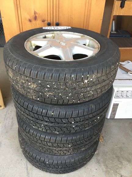 General Motors Tires with Rims - Sherwood Auctions