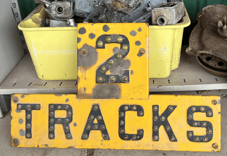 2-Track Sign, Outlet Covers, Cast Iron Corn Sheller - Sherwood Auctions