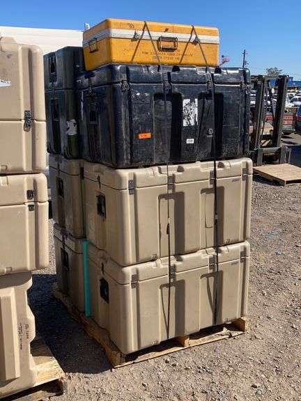 Approximately seven military style hard plastic cargo containers ...