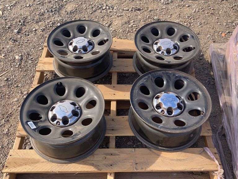 Four Chevrolet 6 lug rims. - Sierra Auction Management Inc