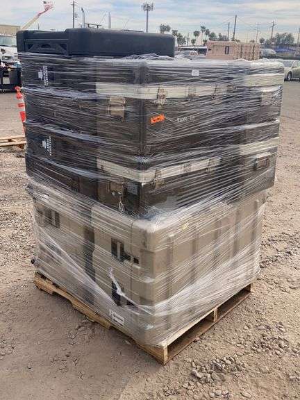 Approximately nine military style hard plastic cargo containers ...