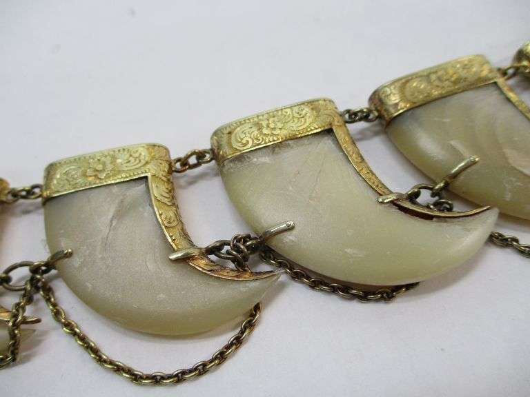 14k Gold Ivory Tooth Necklace 44 grams - Sierra Auction Management Inc