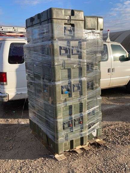 Approximately seven military style hard plastic cargo containers ...