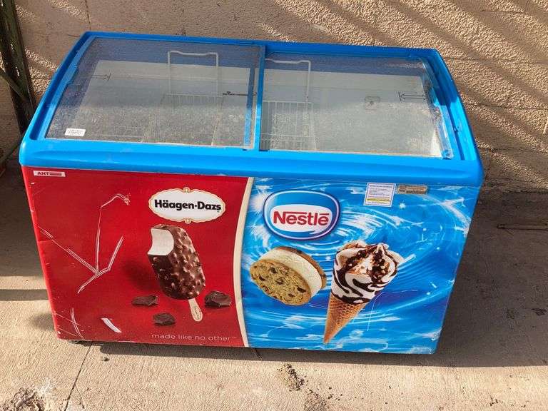 Nestlé ice cream display chest freezer. - Sierra Auction Management Inc
