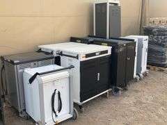 Approximately eight assorted computer charging carts and server tower ...
