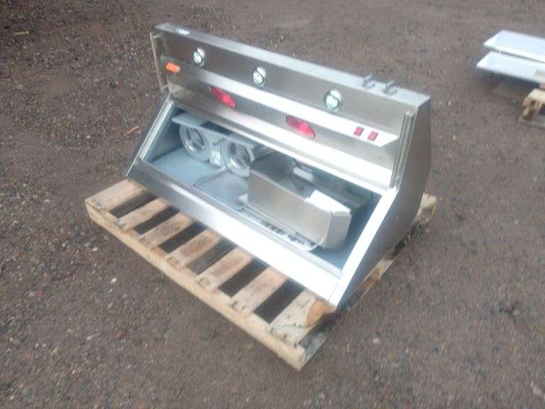 Monogram stainless 4 ft range hood. - Sierra Auction Management Inc