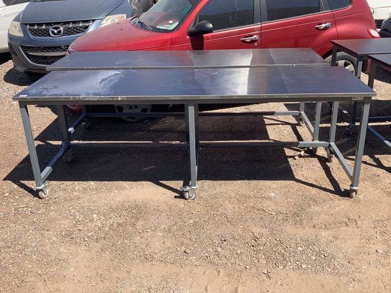 (2) 8 foot locking wheel metal-based work tables. - Sierra Auction ...