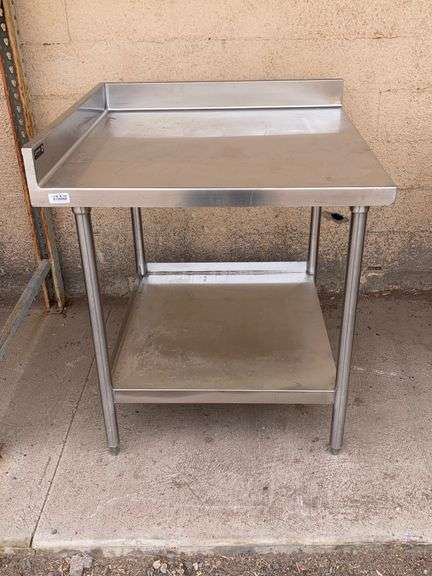 Stainless steel two tier corner prep table. - Sierra Auction Management Inc