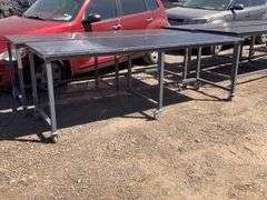 (2) 8 foot locking wheel metal-based work tables. - Sierra Auction ...
