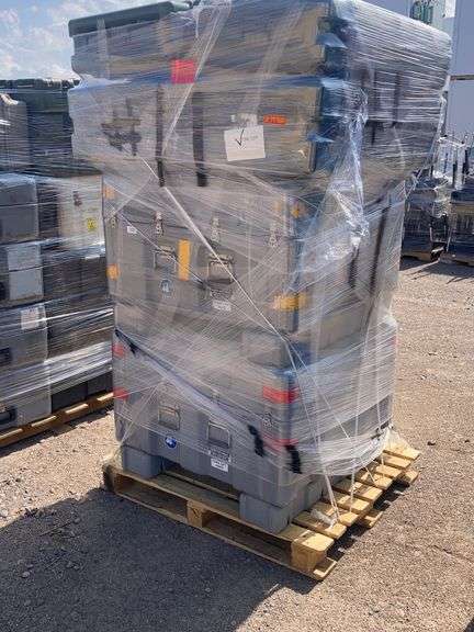 Approximately six military style hard plastic cargo containers ...