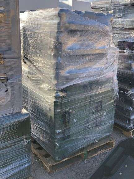 Approximately eight military style hard plastic cargo containers ...