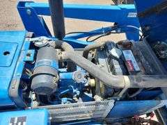 Ford 7106 Backhoe Tractor - Sierra Auction Management Inc