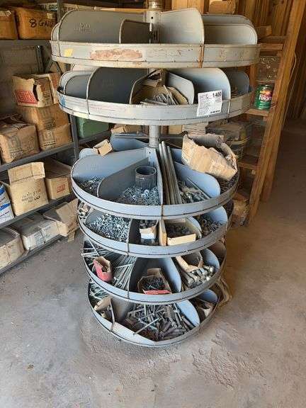 6' Hardware rotating rack Contents included - Sierra Auction Management Inc