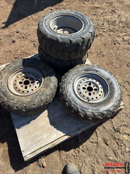 Set of Four wheel tires - Smith Sales Co. Auctioneers