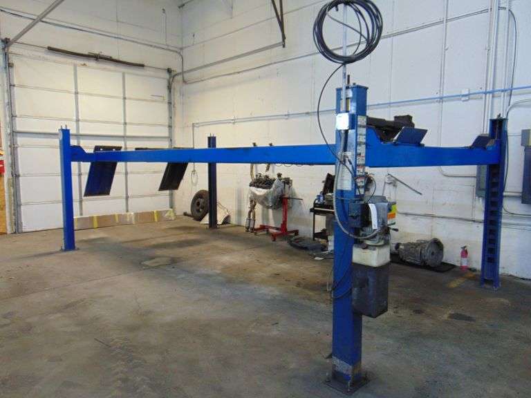 Rotary 4 Post Car Lift - Bright Star Real Estate Services