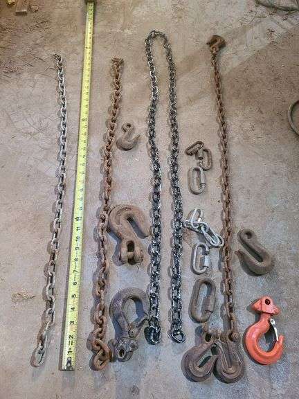 Assorted chains, links, and hooks in metal bucket - T&S Auction Service