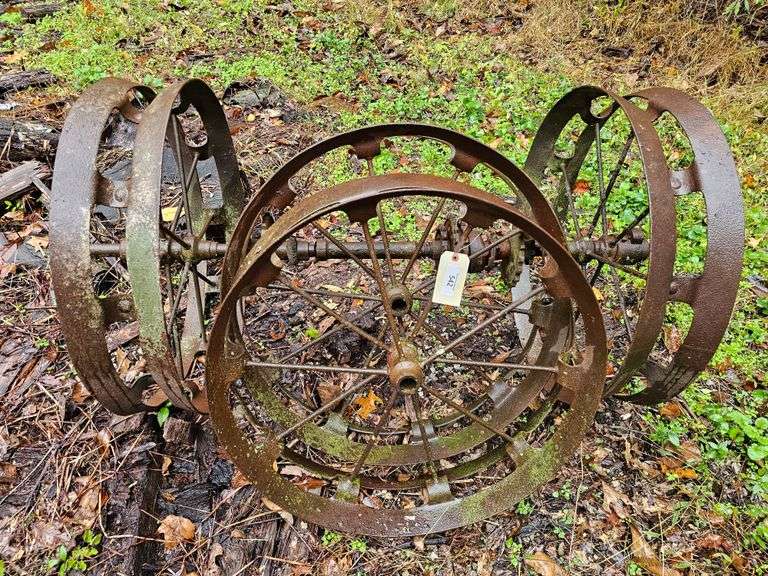Four steel wheels and axle - T&S Auction Service