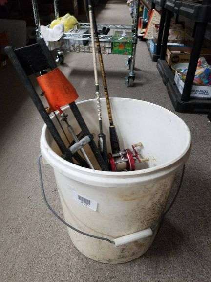 Bucket of assorted fishing rods and reels - Trice Auctions
