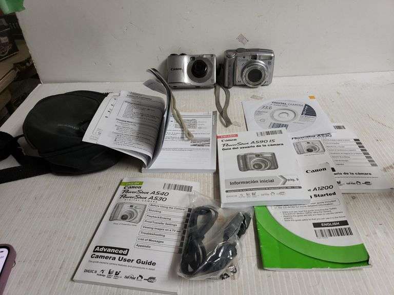 Canon Powershot Cameras, Instruction Books, Case - Trice Auctions