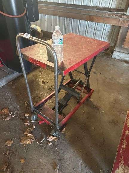 Metal Hydraulic Lift Table on Casters - Trice Auctions
