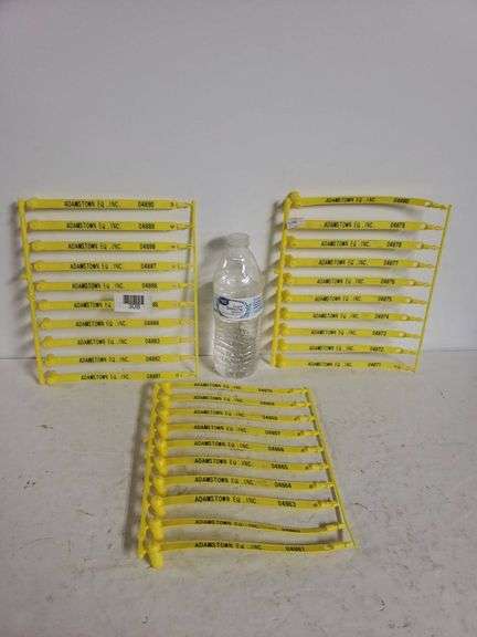 Yellow Identification Tags Marked ‘Adamstown EQ. INC.’ - Trice Auctions