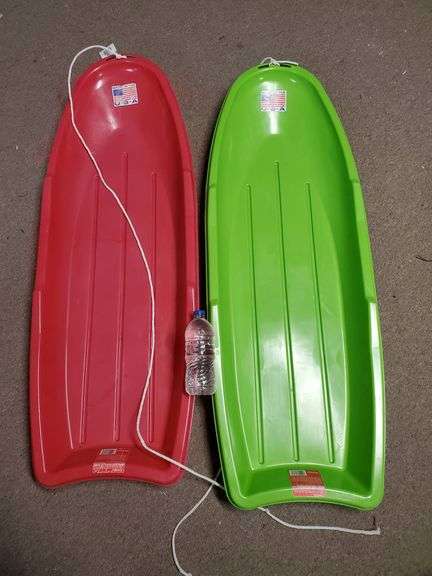 Red and Green Plastic Sleds with Pull Ropes - Trice Auctions