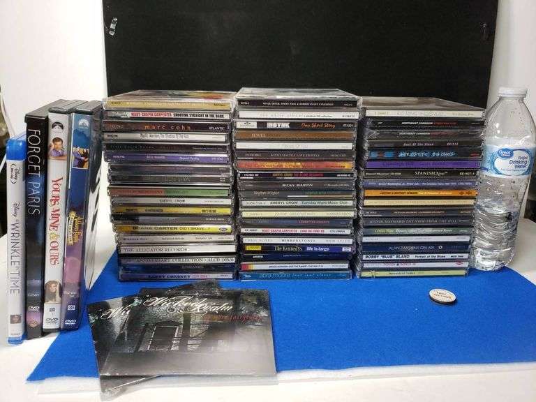 Collection of CDs and DVDs in Cases - Trice Auctions
