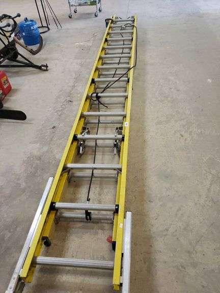 Werner Extension Ladder with Yellow Rails and Metal Rungs - Trice Auctions
