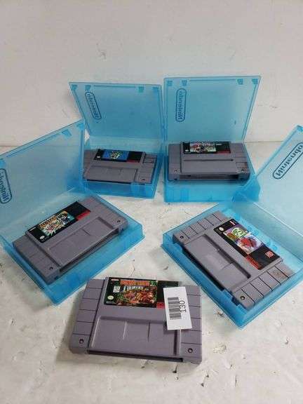 Super Nintendo Game Cartridges Including Super Mario and Donkey Kong ...