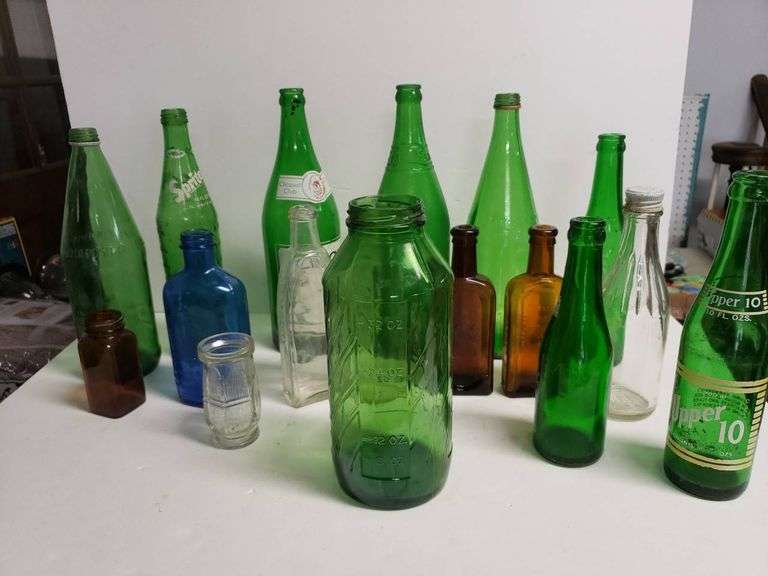 Collection of Assorted Glass Bottles in Various Colors and Shapes ...