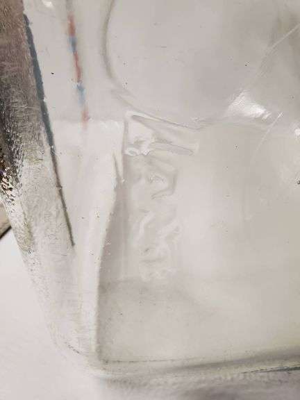 Lance Glass Jar With Embossed Logo and Red Metal Lid - Trice Auctions