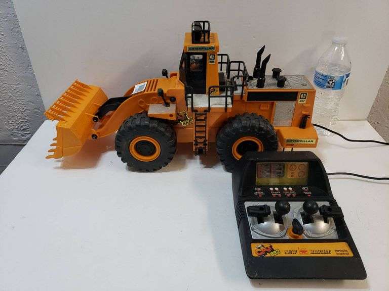 1986 New Bright CAT 992 Remote Control Front Loader - Trice Auctions
