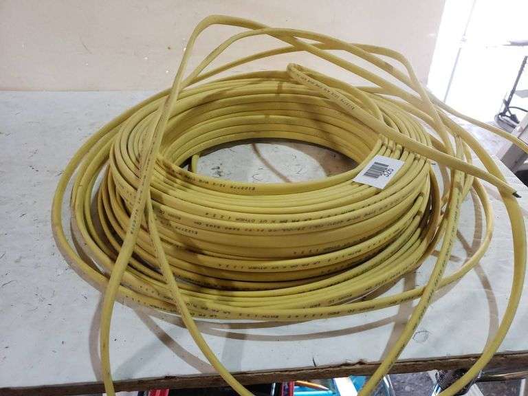 Coiled Yellow Electrical Wire With Printed Specifications - Trice Auctions