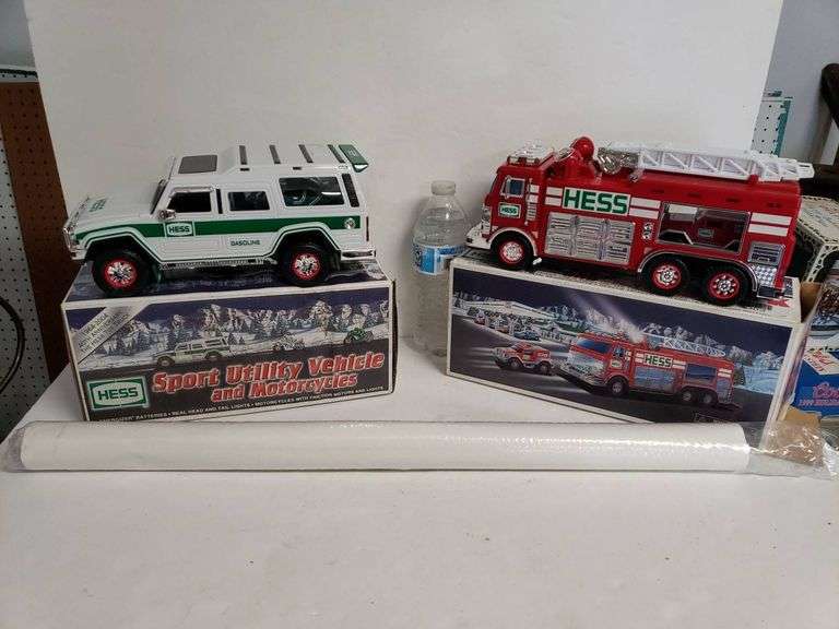 (2) Hess Trucks in Boxes (Water Damage to Boxes) & Poster - Trice Auctions