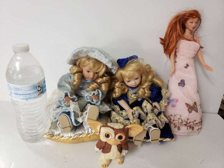 Dolls Including 2 Porcelain Dolls, 1 Figurine, and 1 Fashion Doll ...