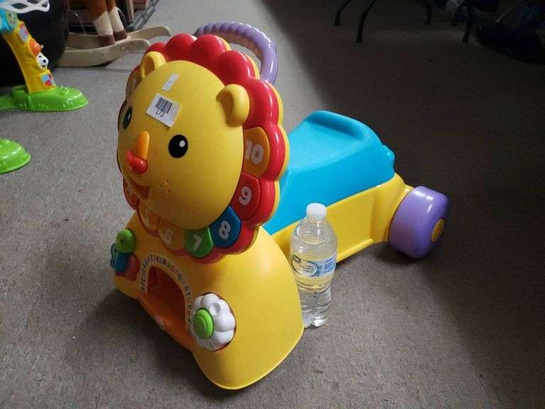 Lion-Themed Push or Ride-On Toy With Educational Features - Trice Auctions