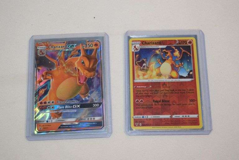 (2) Pokémon Charizard Cards - Shackelton Auctions Inc.