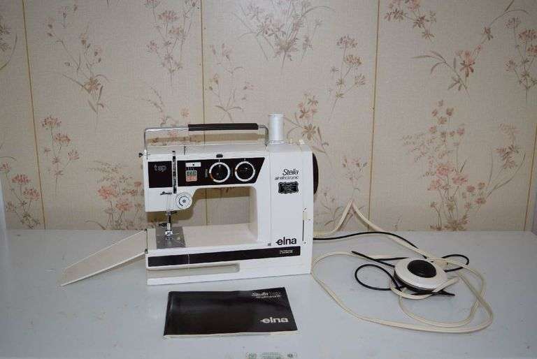 Elna Stella Air Electronic Sewing Machine - Shackelton Auctions Inc.
