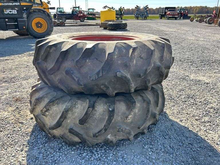 PAIR OF GOODYEAR 14.9X24 TIRES & RIMS - Shackelton Auctions Inc.