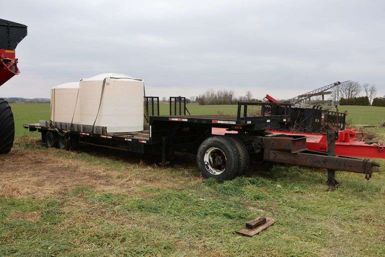 37' TANDEM AXLE TRAILER WITH TANKS AND JOE DOG - Shackelton Auctions Inc.