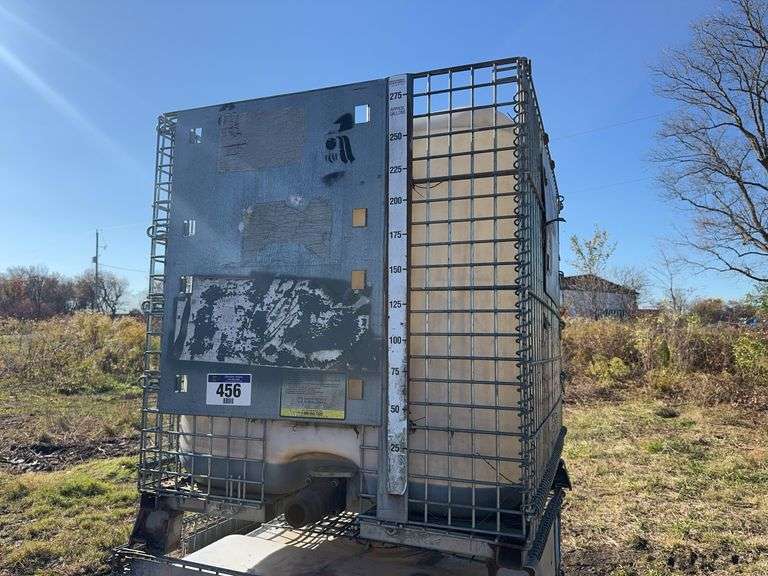 1000 LITRE CAGED POLY TOTE - USED FOR USED OIL - Shackelton Auctions Inc.