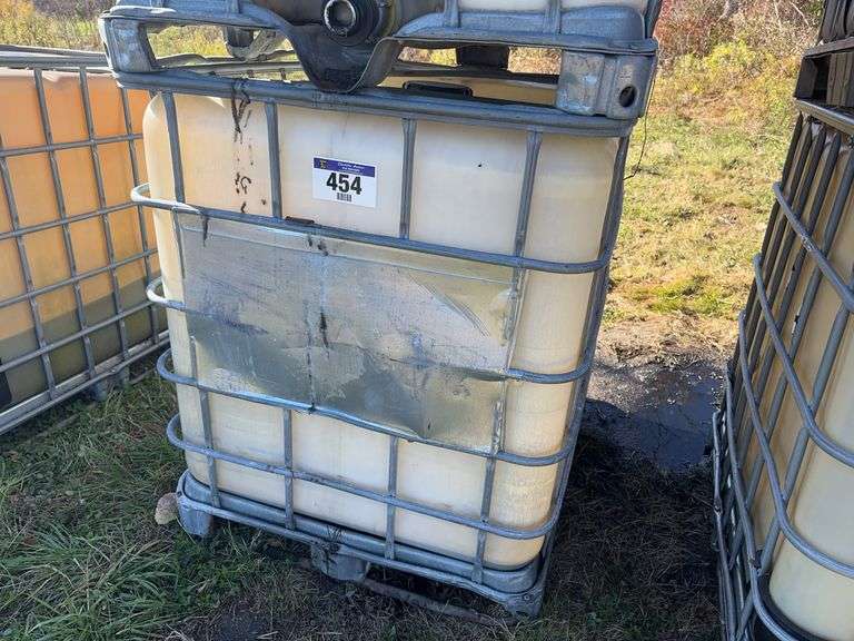 1000 LITRE CAGED POLY TOTE - USED FOR USED OIL - Shackelton Auctions Inc.