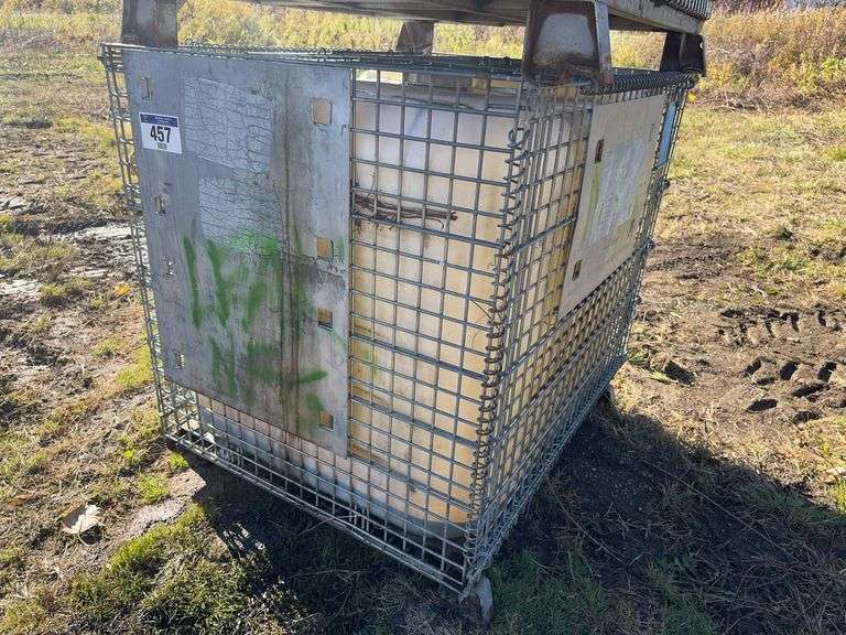 1000 LITRE CAGED POLY TOTE - USED FOR USED OIL - Shackelton Auctions Inc.