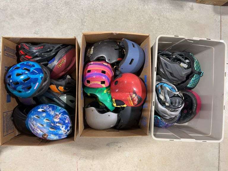 TWO BOXES AND ONE TOTE OF ASSORTESD BIKE HELMETS - Shackelton Auctions Inc.